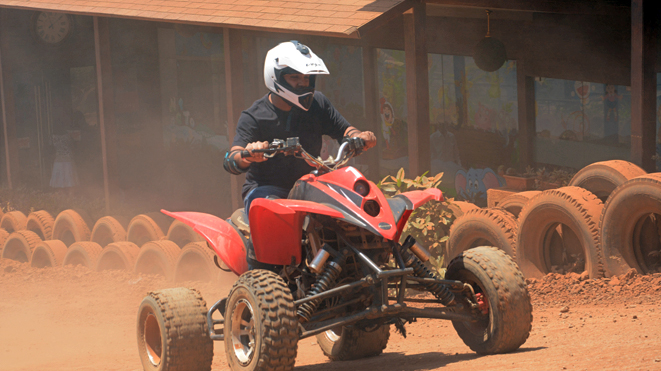 Ride ATV through a rough terrain and feel the thrill at Della Adventure